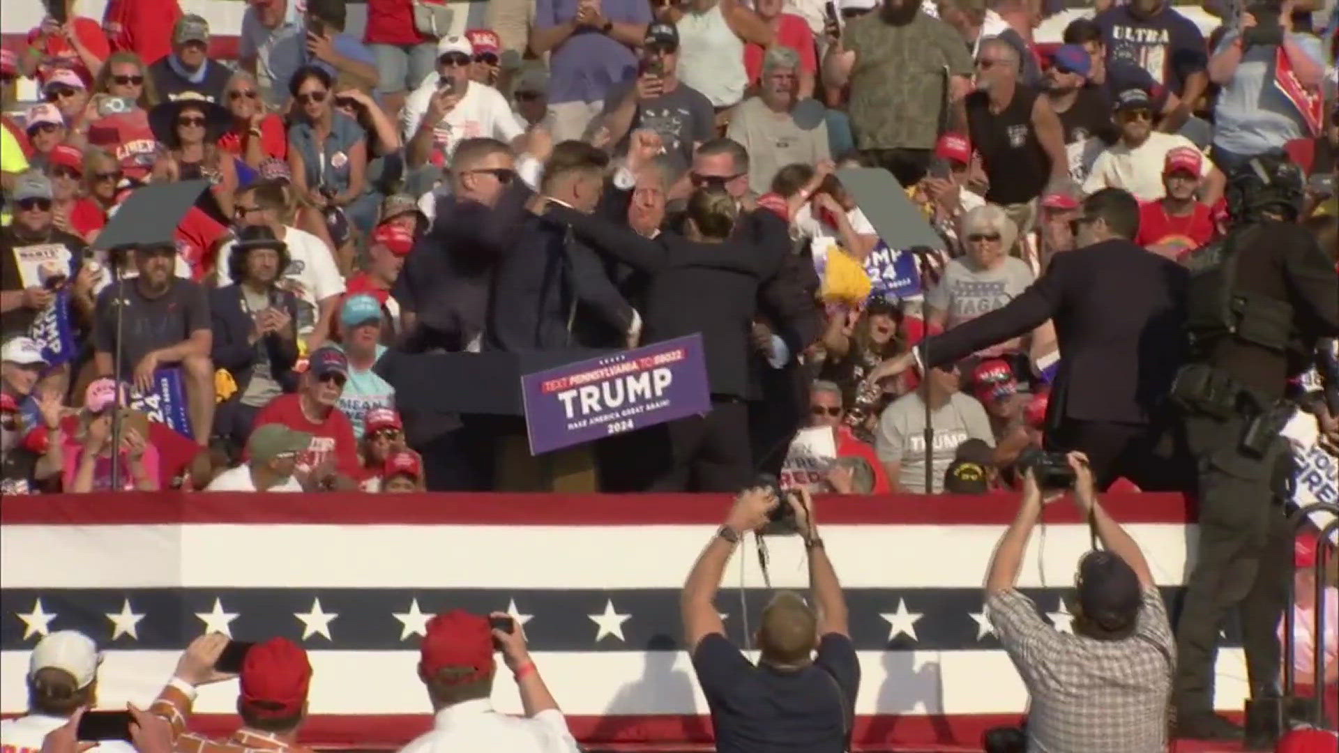 Former President Trump ushered off stage after an attempted ...