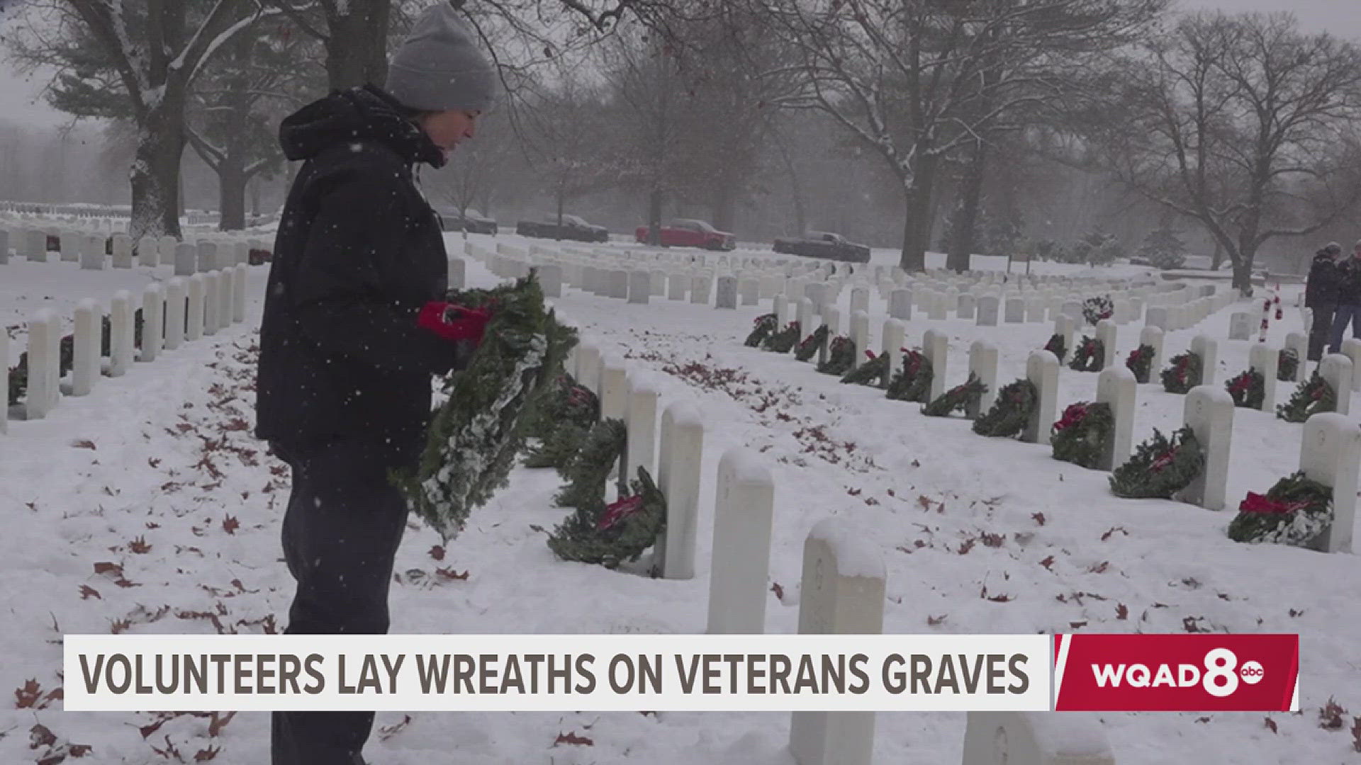 Volunteers brave snow to honor veterans at Rock Island Arsenal | wqad.com