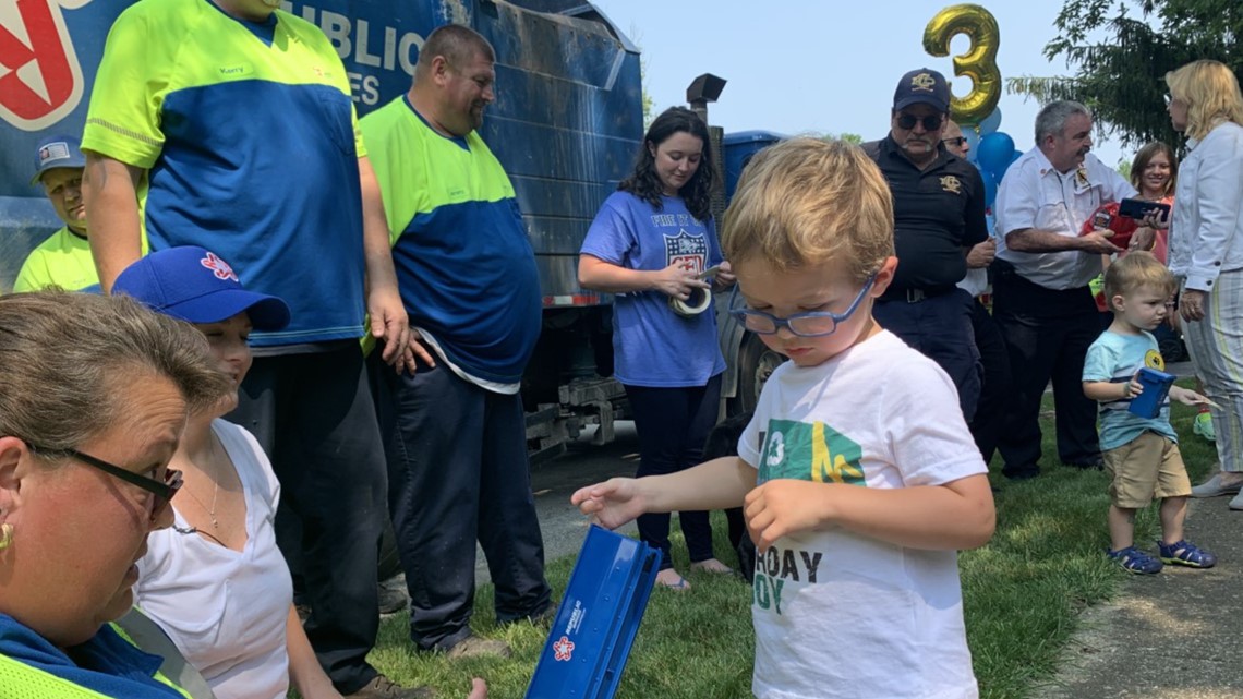 Carmel boy's birthday parade led by a fleet of garbage trucks | wthr.com