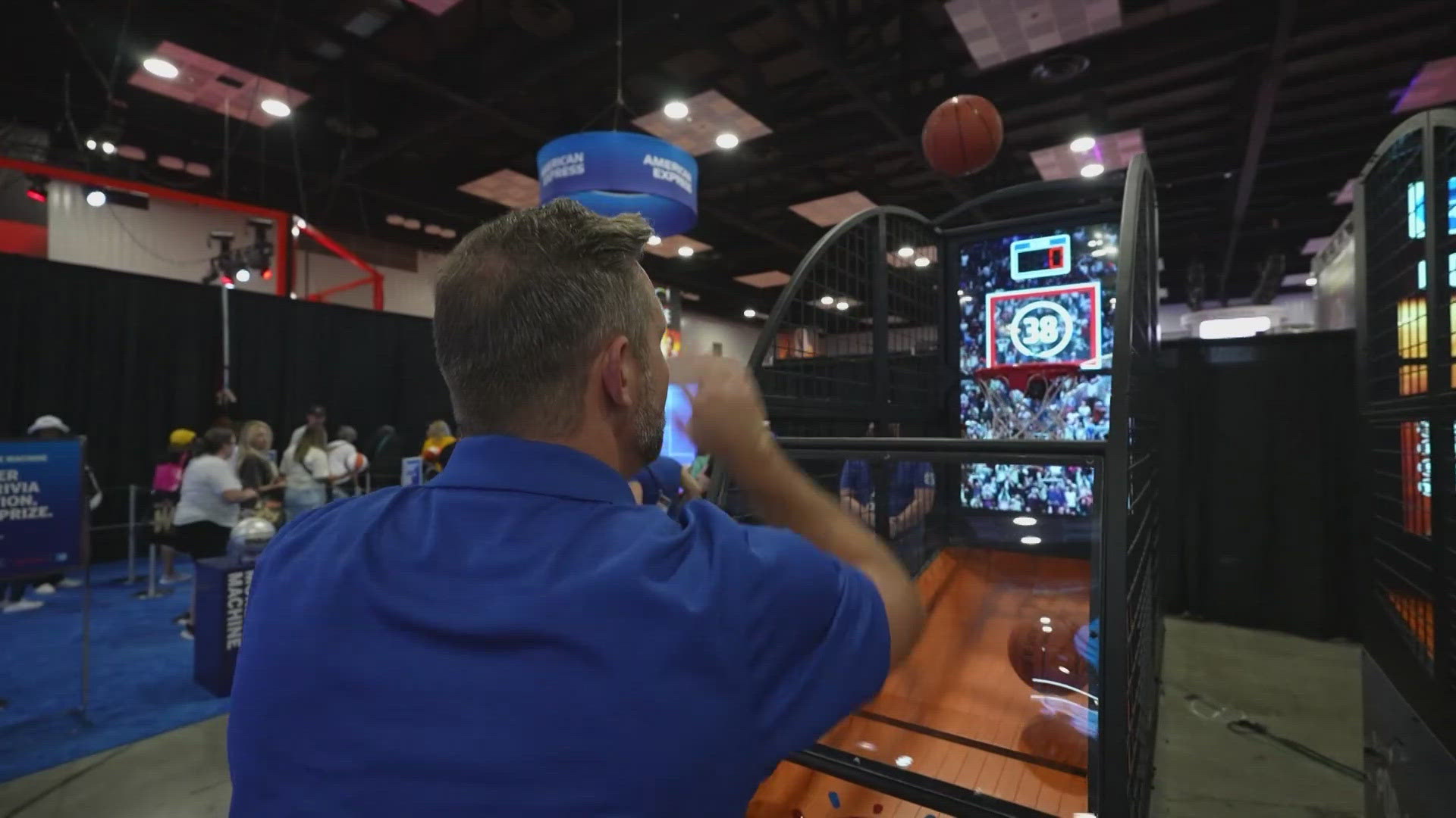13News anchor Dustin Grove shoots hoops during WNBA Live in ...