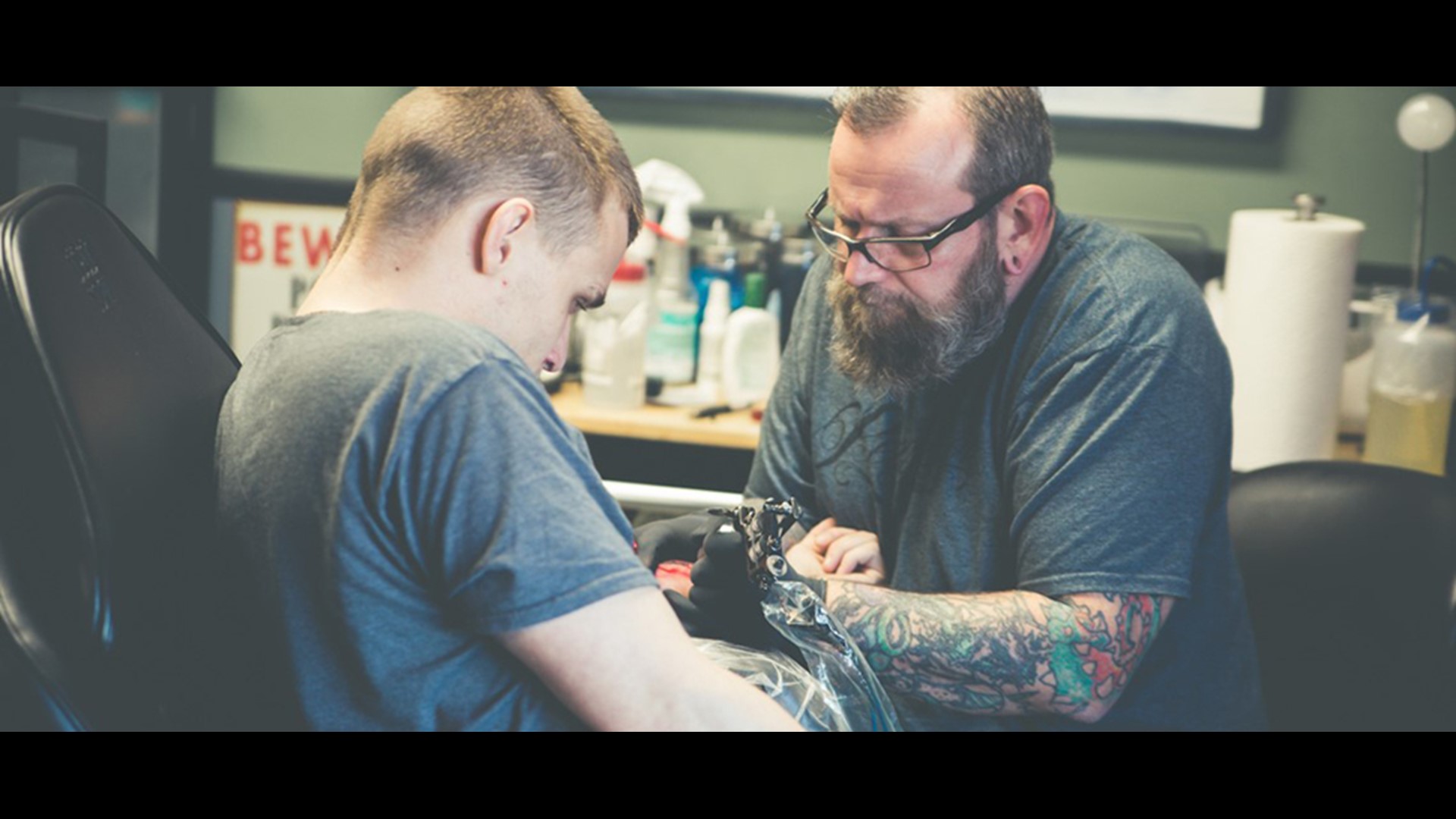 'People change': Tattoo artist travels the country covering racist ...