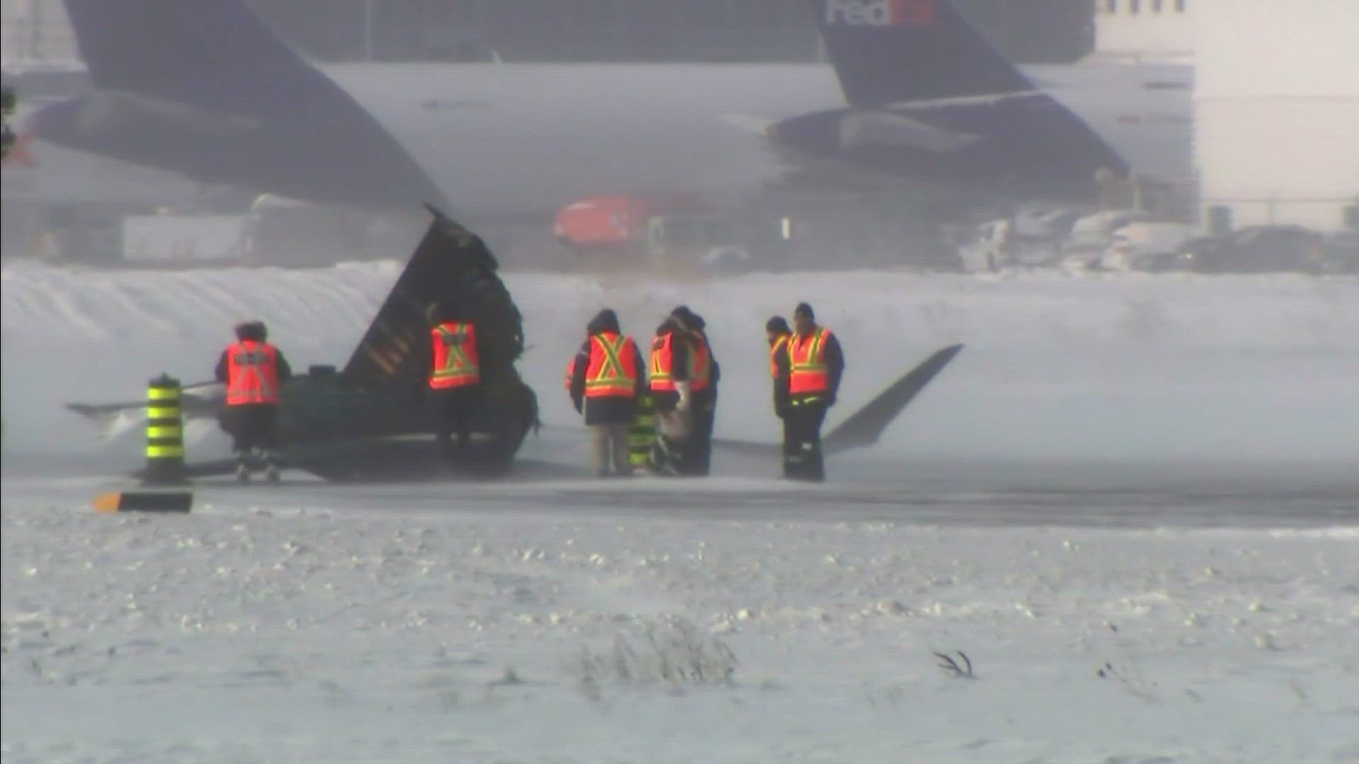 Delta flight crashes at Toronto Airport after landing, flips upside ...