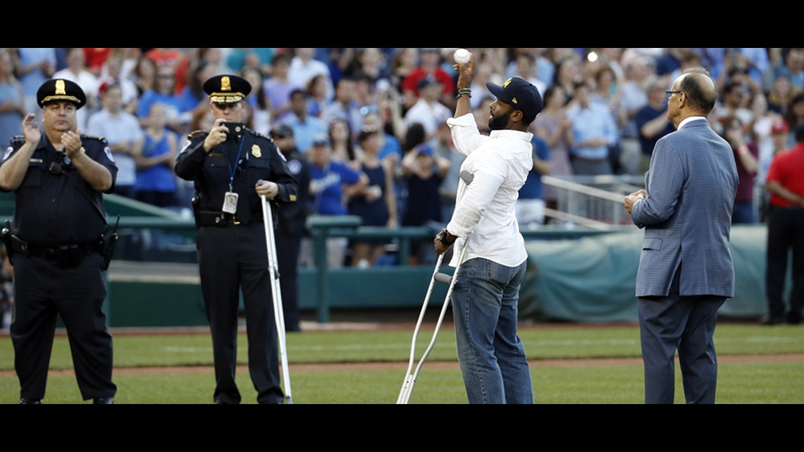 Wounded Capitol Police officer throws out first pitch of Congressional ...