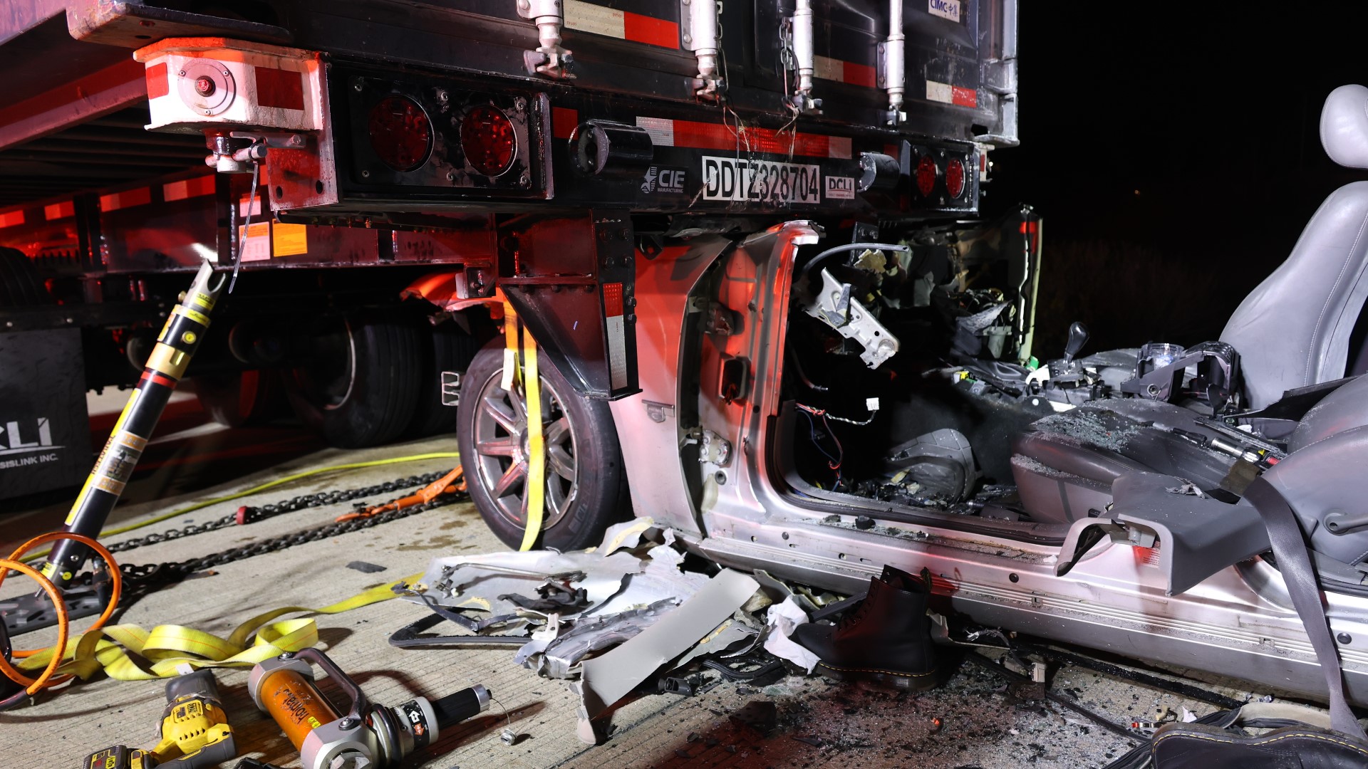 1 in seriously injured after car gets trapped under semi in Indy | wthr.com