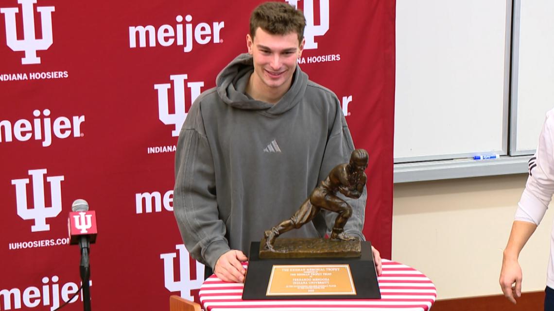 The Heisman is home! Mendoza returns to Indiana with coveted collegiate ...