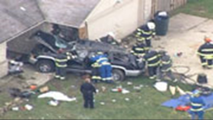 Two injured when SUV hits Lawrence house | wthr.com