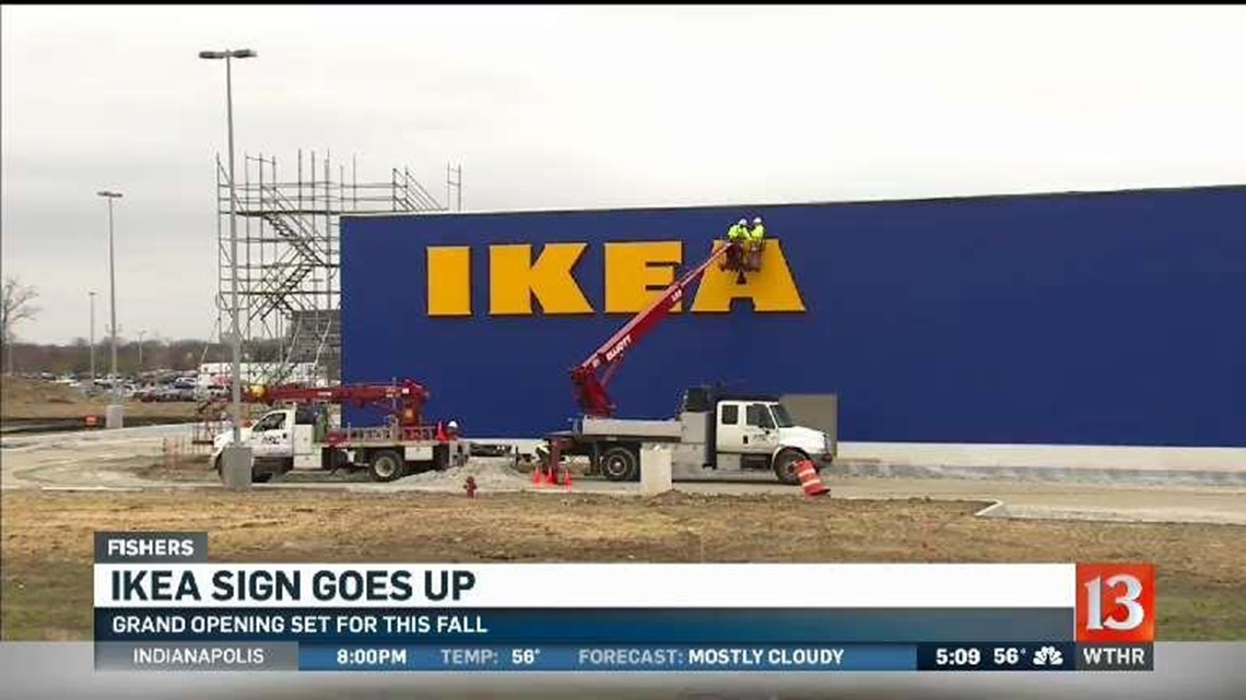 Workers add IKEA signage to building exterior | wthr.com
