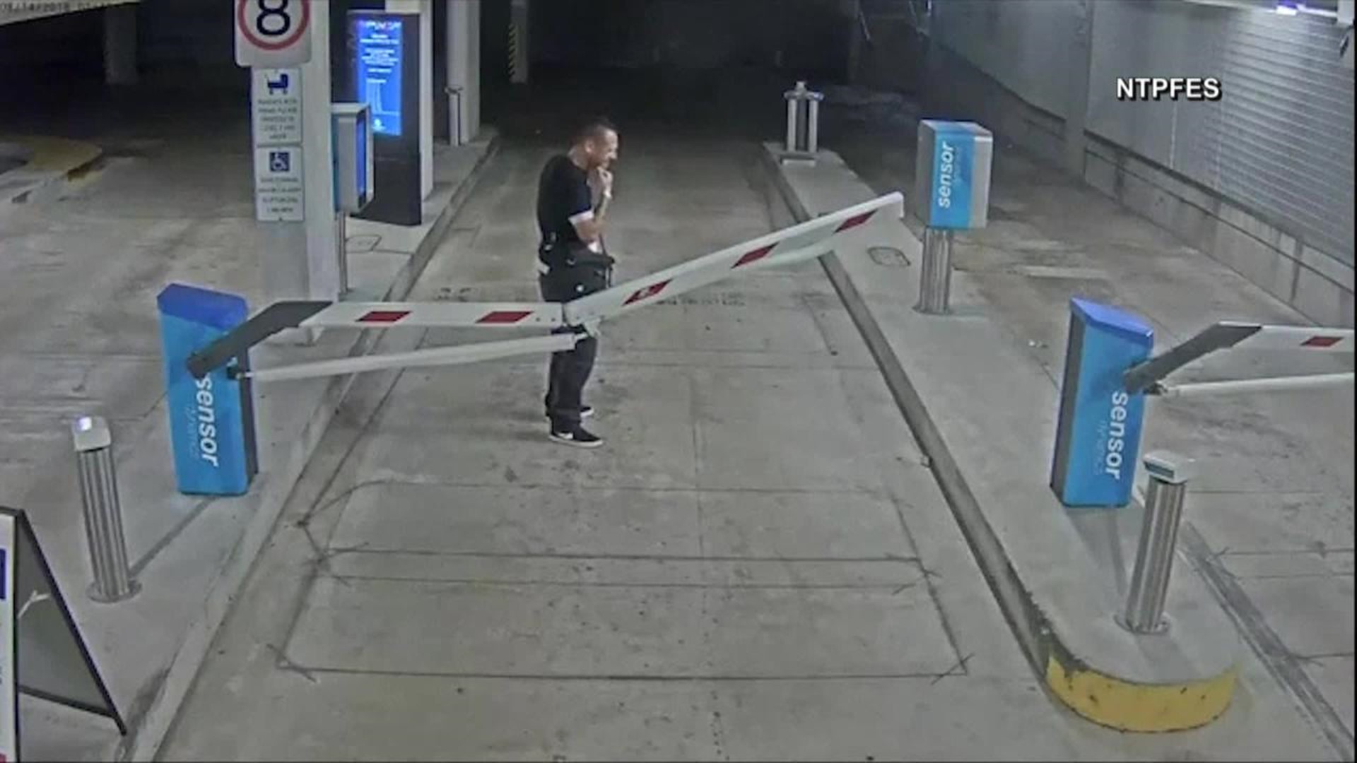 CAUGHT ON CAMERA: Man charges into parking lot gate entrance | wthr.com