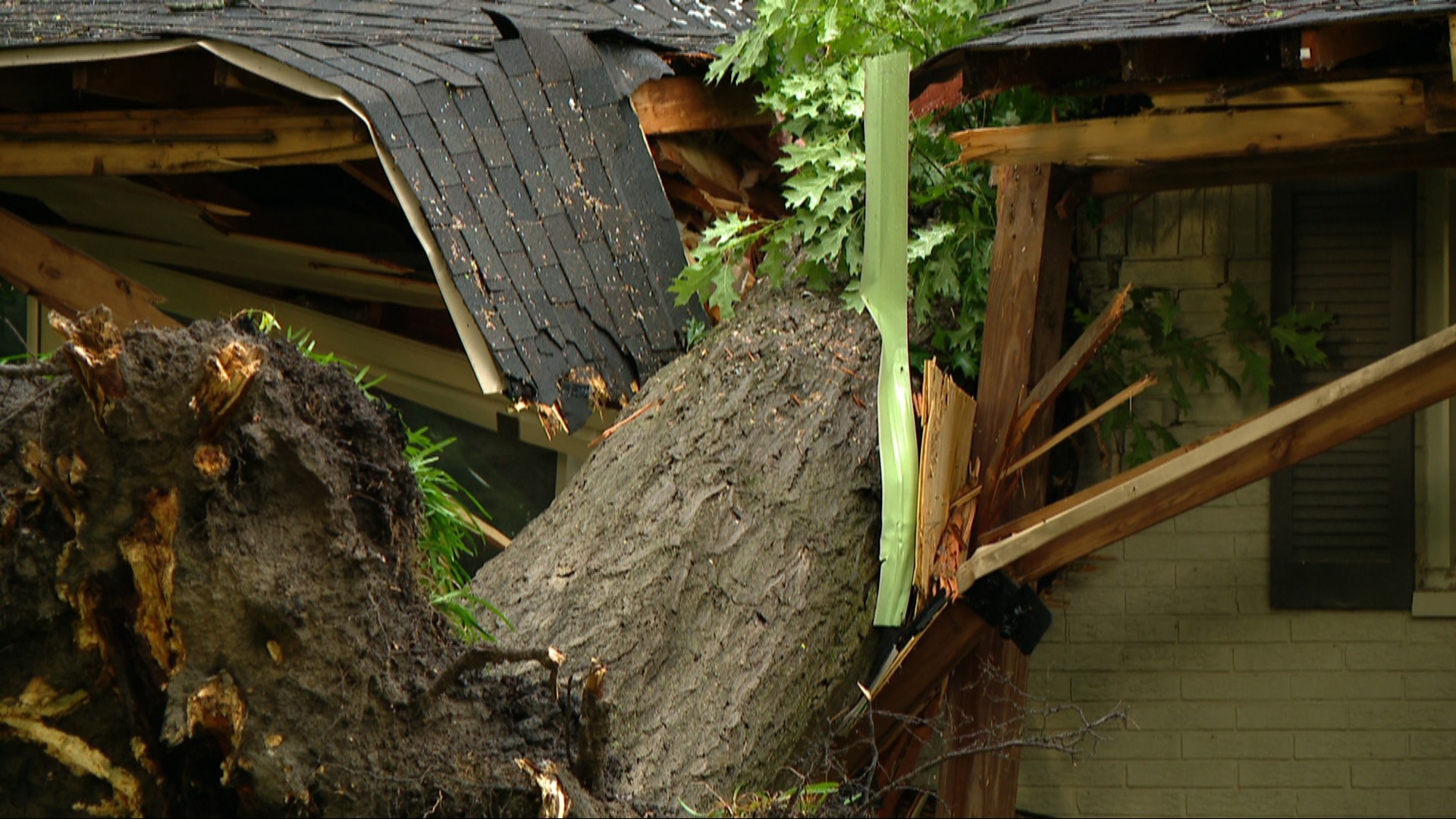 Strong storms cause damage, sends tree crashing through Lawrence home ...