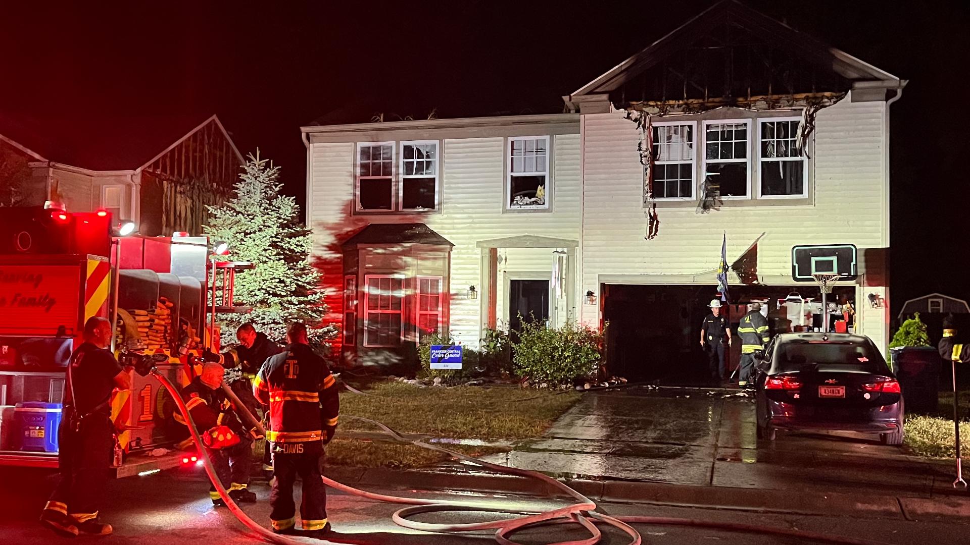 Indy firefighters hospitalized after floor collapses in home fire ...