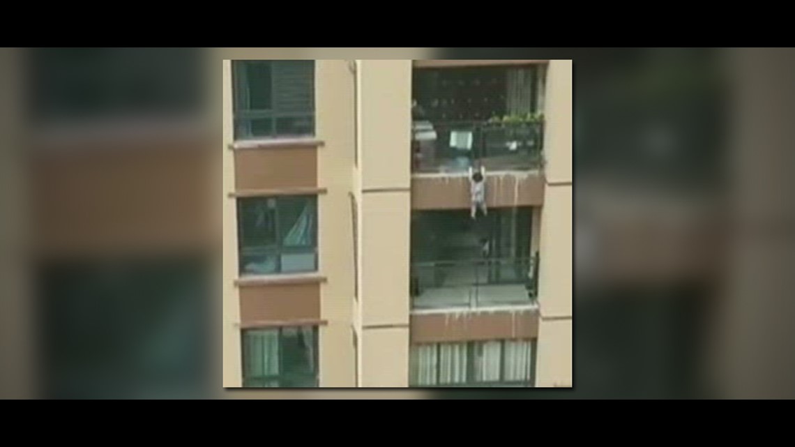 WATCH: Bystanders catch toddler who falls from sixth-floor balcony ...