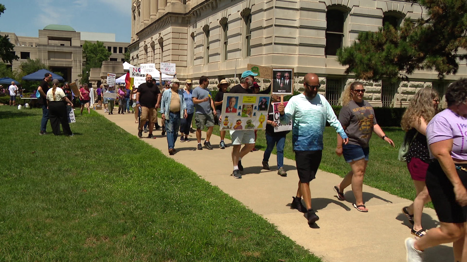 Protesters march outside Indiana Statehouse against President Trump ...
