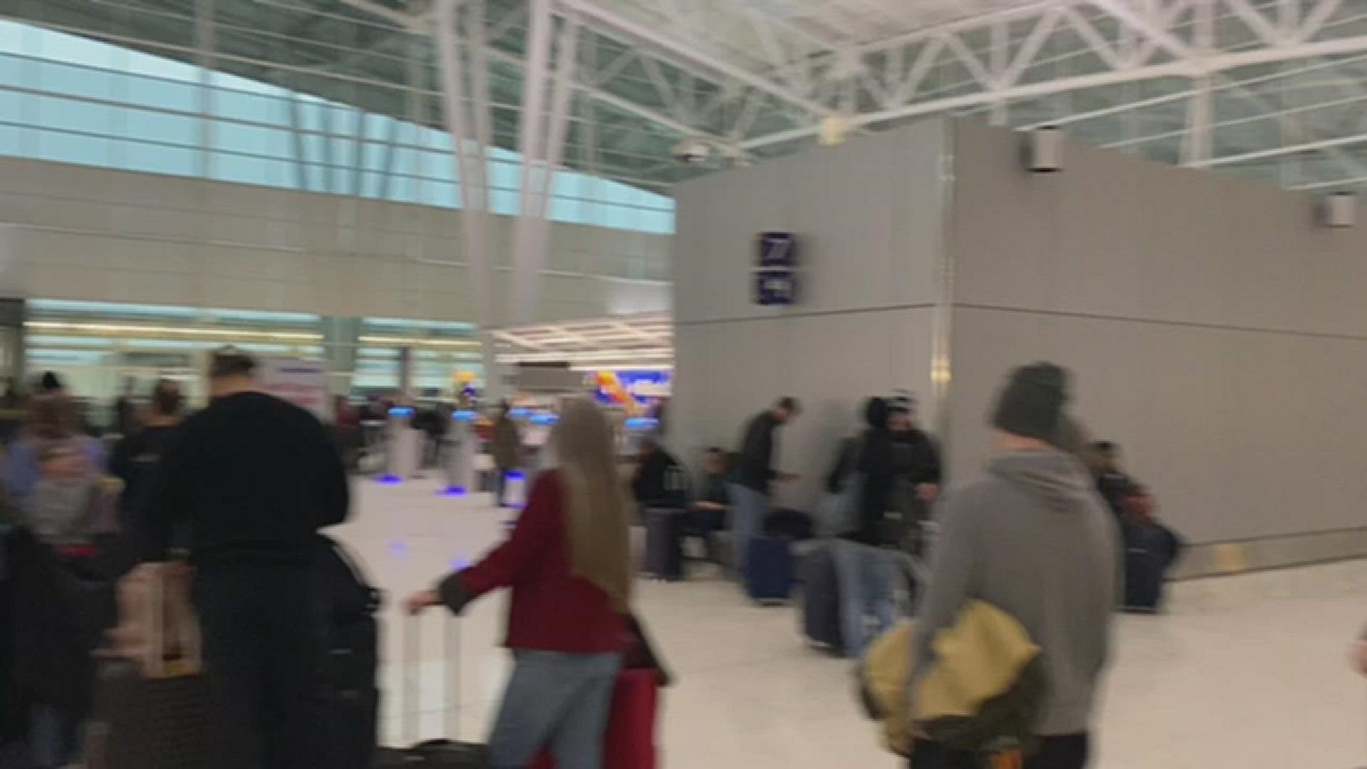 Travelers crowd the Southwest Airlines counter at IND | wthr.com