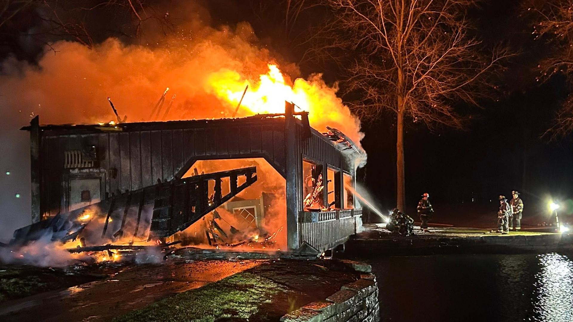 Crews battle building fire over golf course pond at Westfield country ...