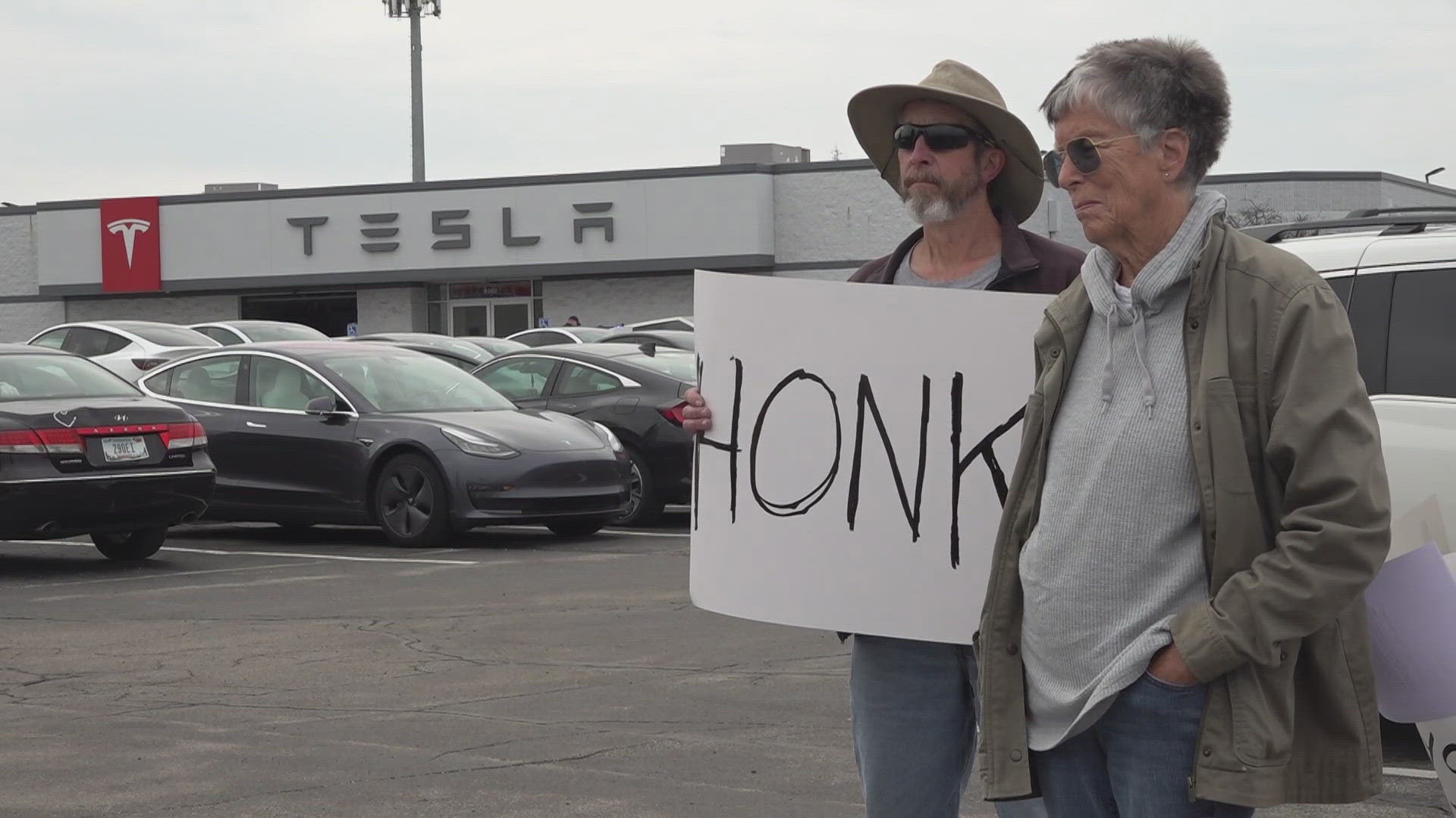 Dozens of Hoosiers join in worldwide protests against Tesla and Elon ...
