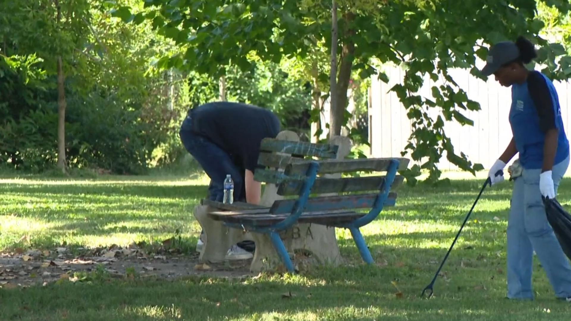 Volunteers spruce up Haughville Park ahead of IMPD Community Day | wthr.com