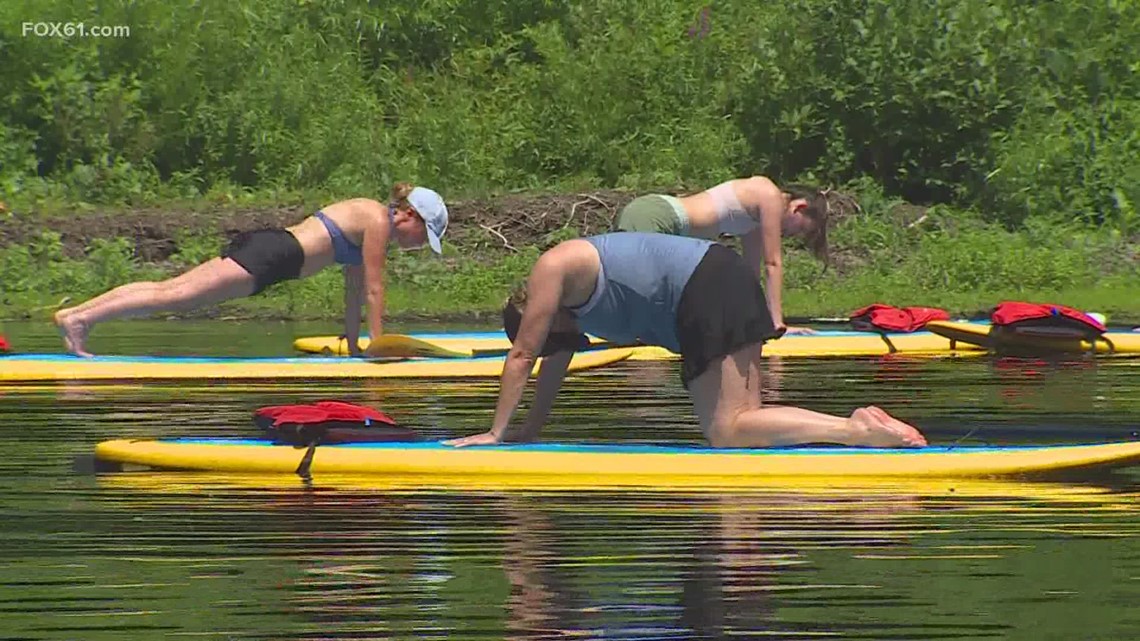 Paddle board yoga brings balance into beating heat in Connecticut ...