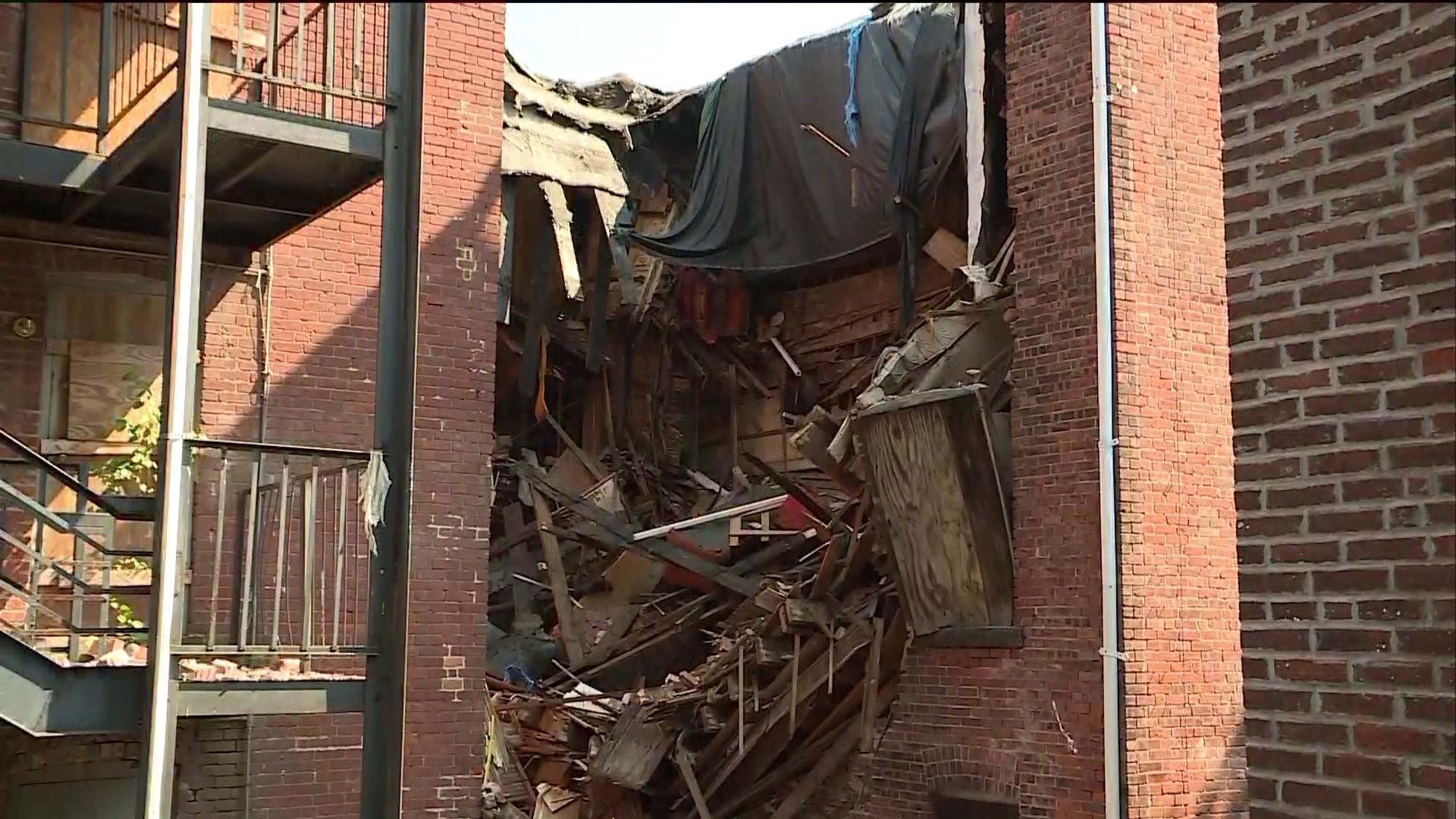 Demolition crews tear down partially collapsed building in Hartford ...