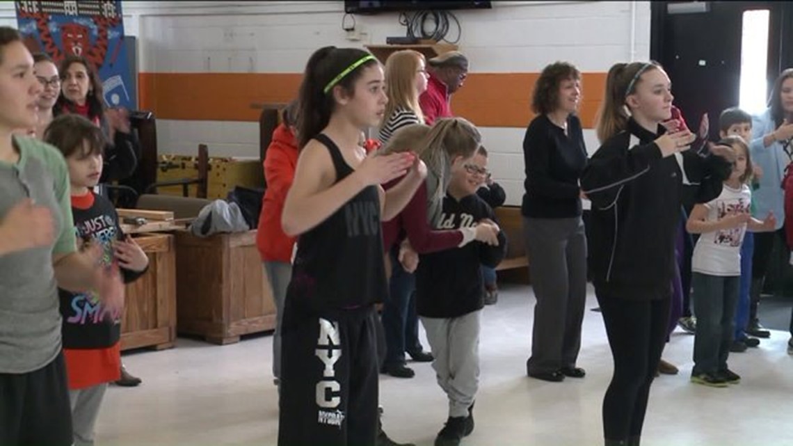 Kids at the American School for the Deaf feel the beat and move their ...