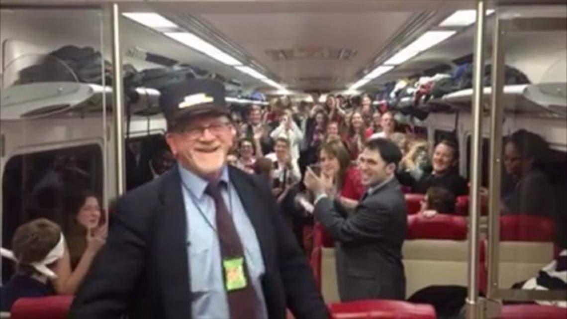 Watch: Metro North train conductor conducts caroling Yale Glee Club ...
