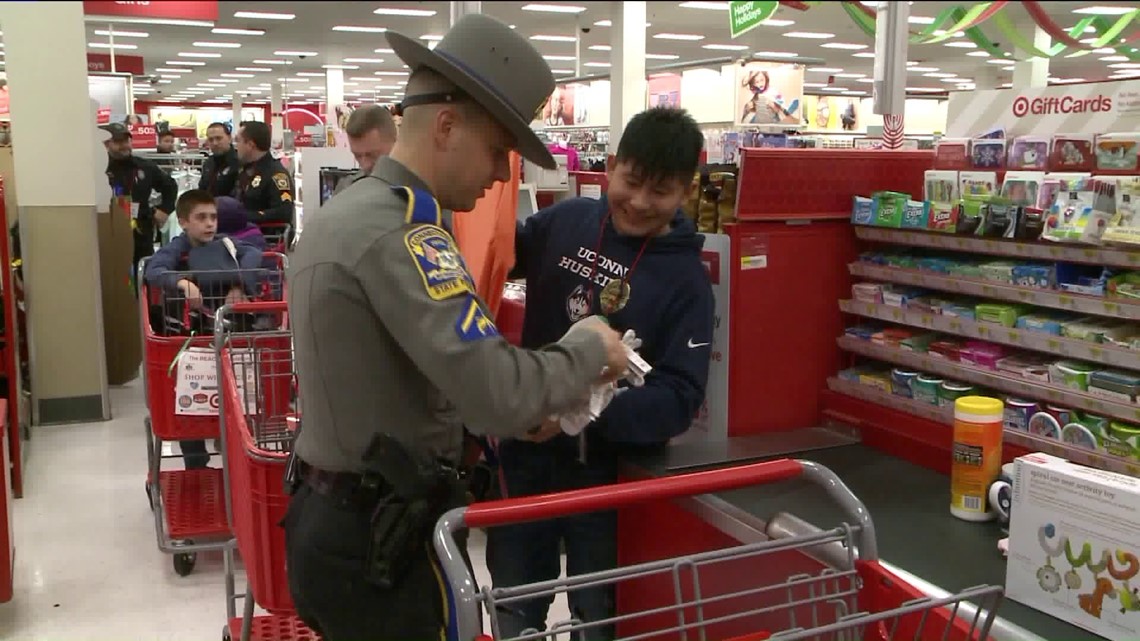 Police officers spread holiday cheer at annual ‘Shop with a Cop’ event ...