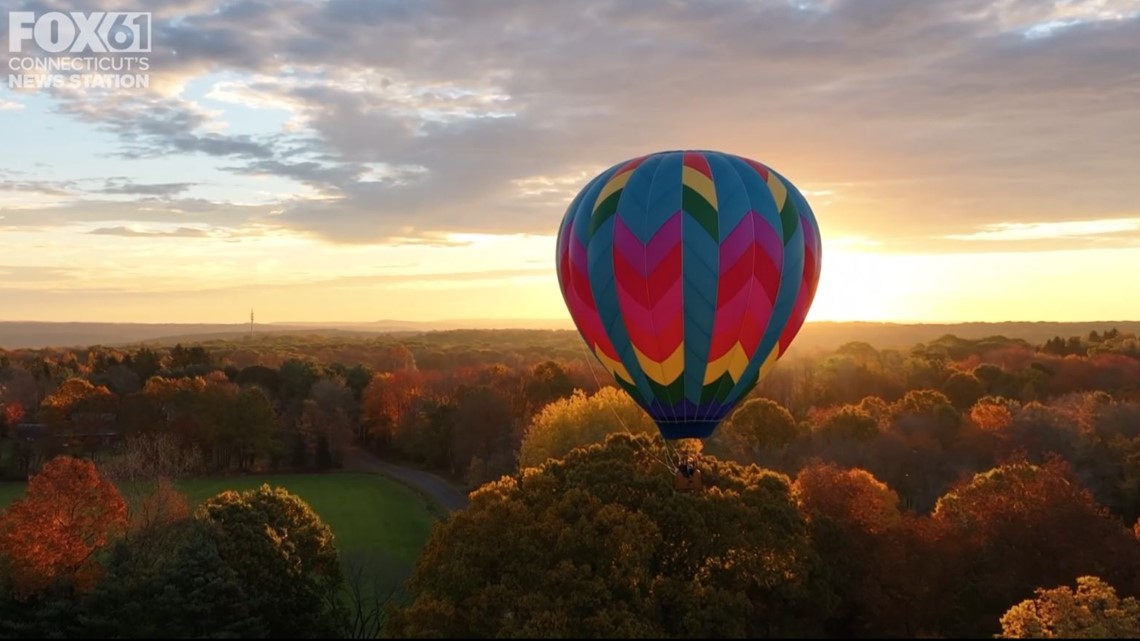 Hot air balloon over fall foliage during Connecticut sunrise | Sky61 ...