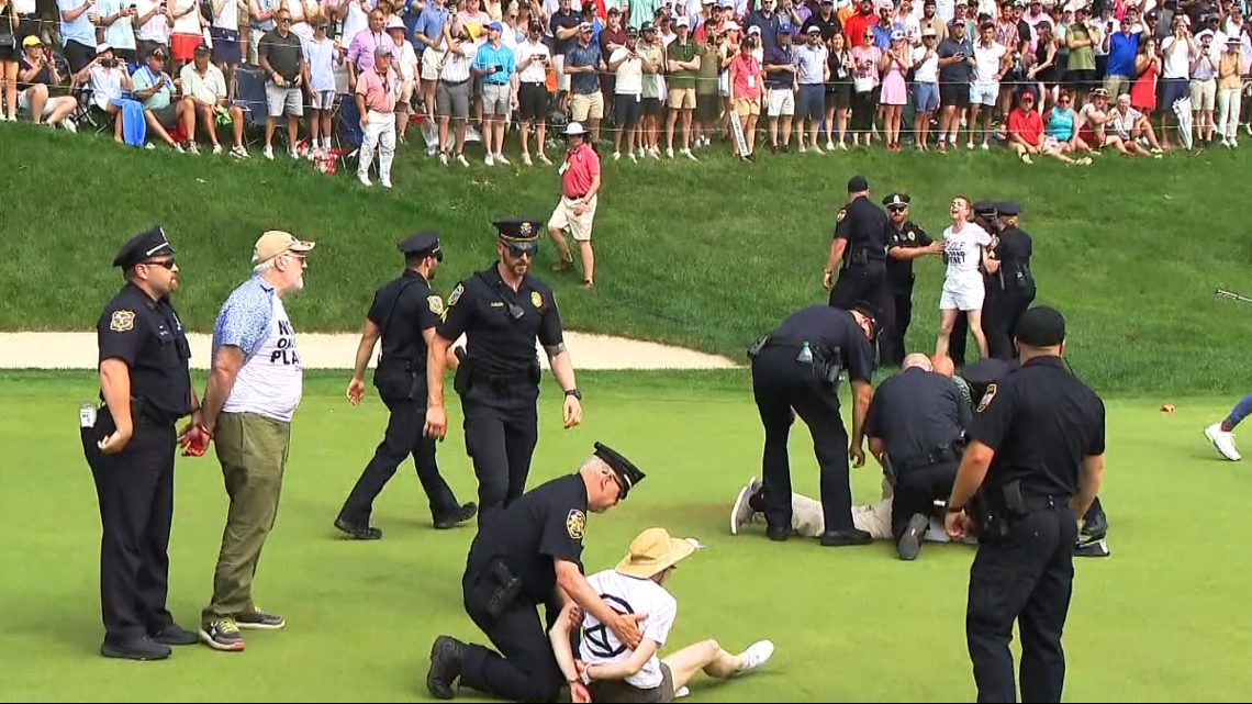 Protesters at Travelers Championship tackled by police after running ...