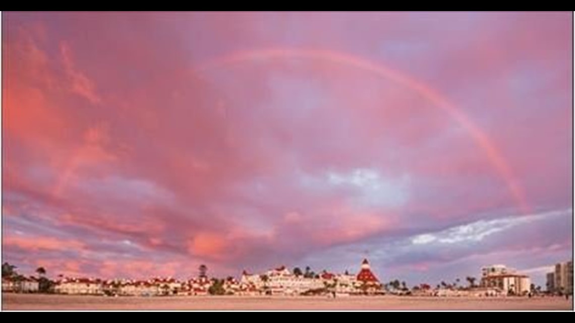 Photographer searches for couple captured in proposal under rainbow ...