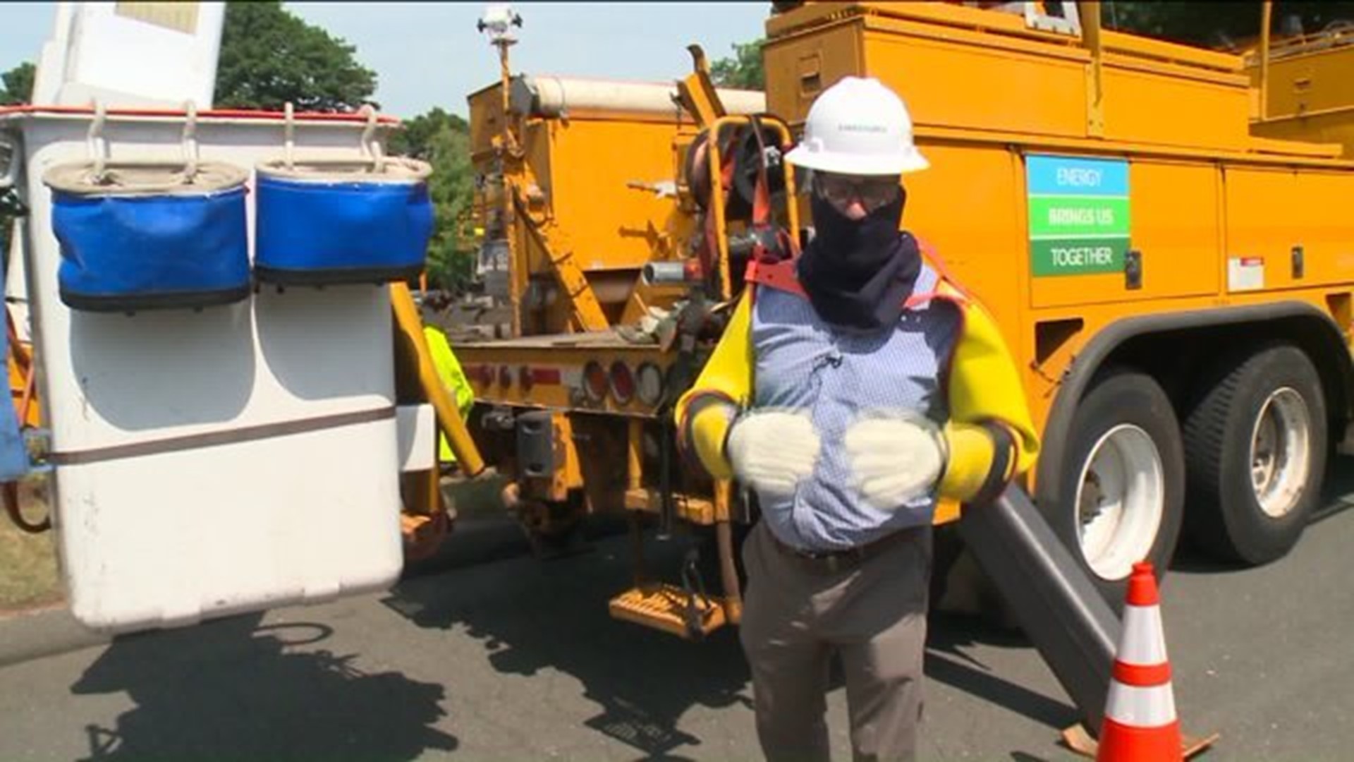 Eversource crews working on powerlines take measures to be safe during ...