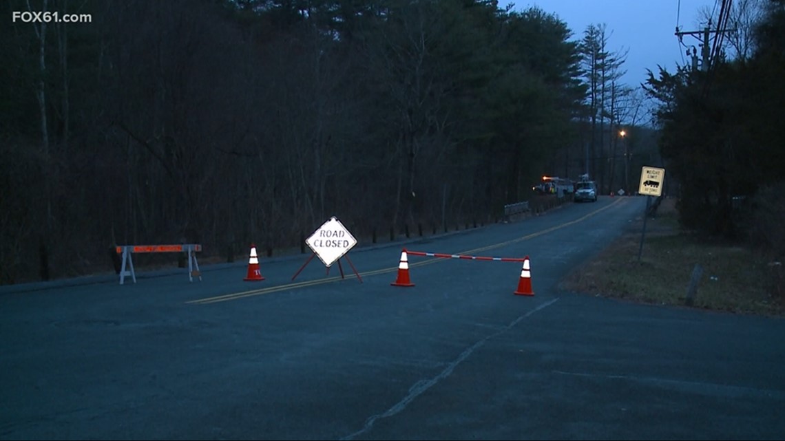 Car crashes into telephone pole, house in Simsbury, officials say ...