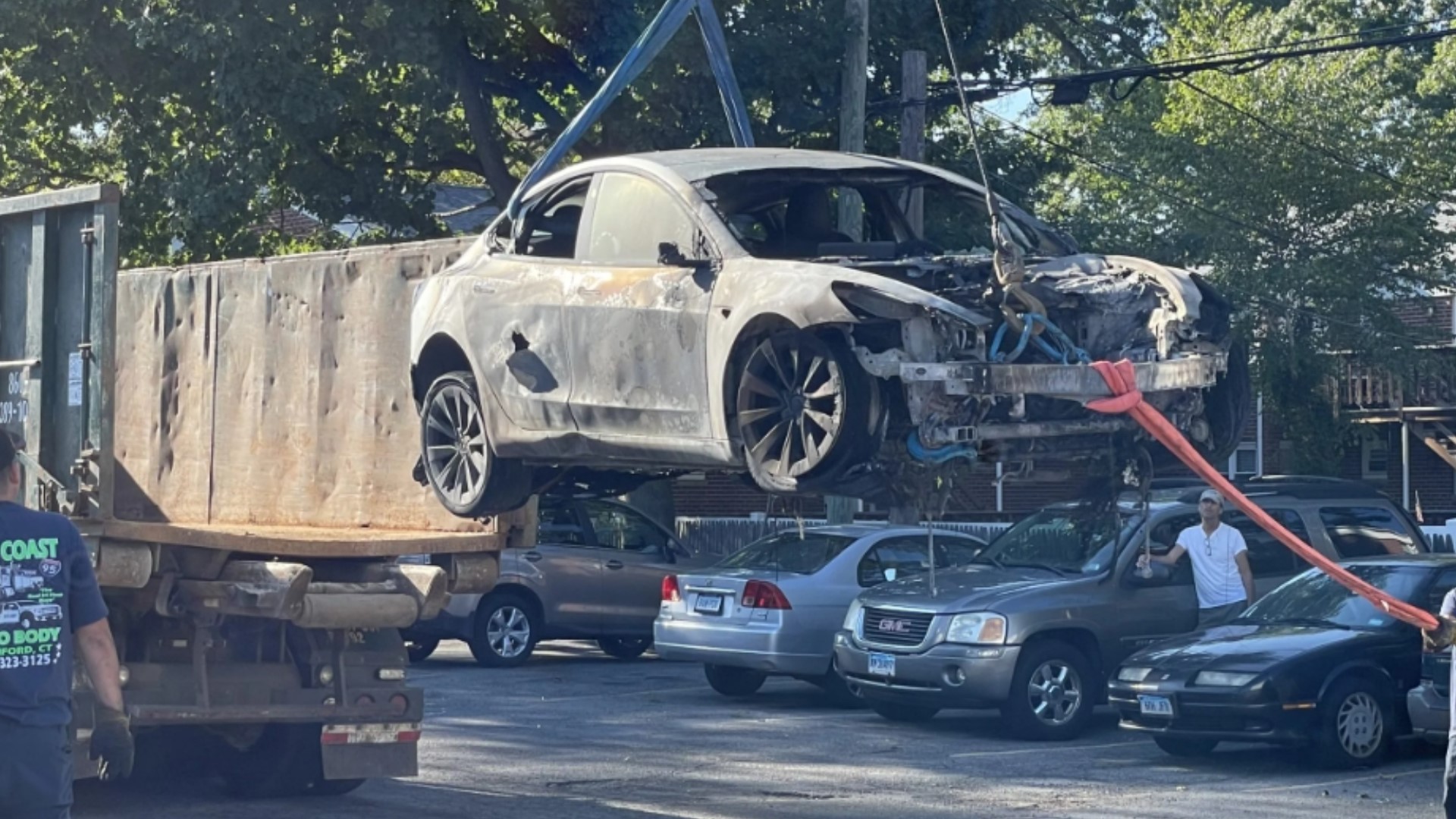 Tesla car catches on fire, takes firefighters nearly an hour to p ...