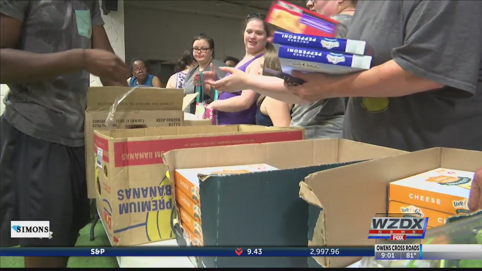 Hundreds of people in Hazel Green take home free groceries ...