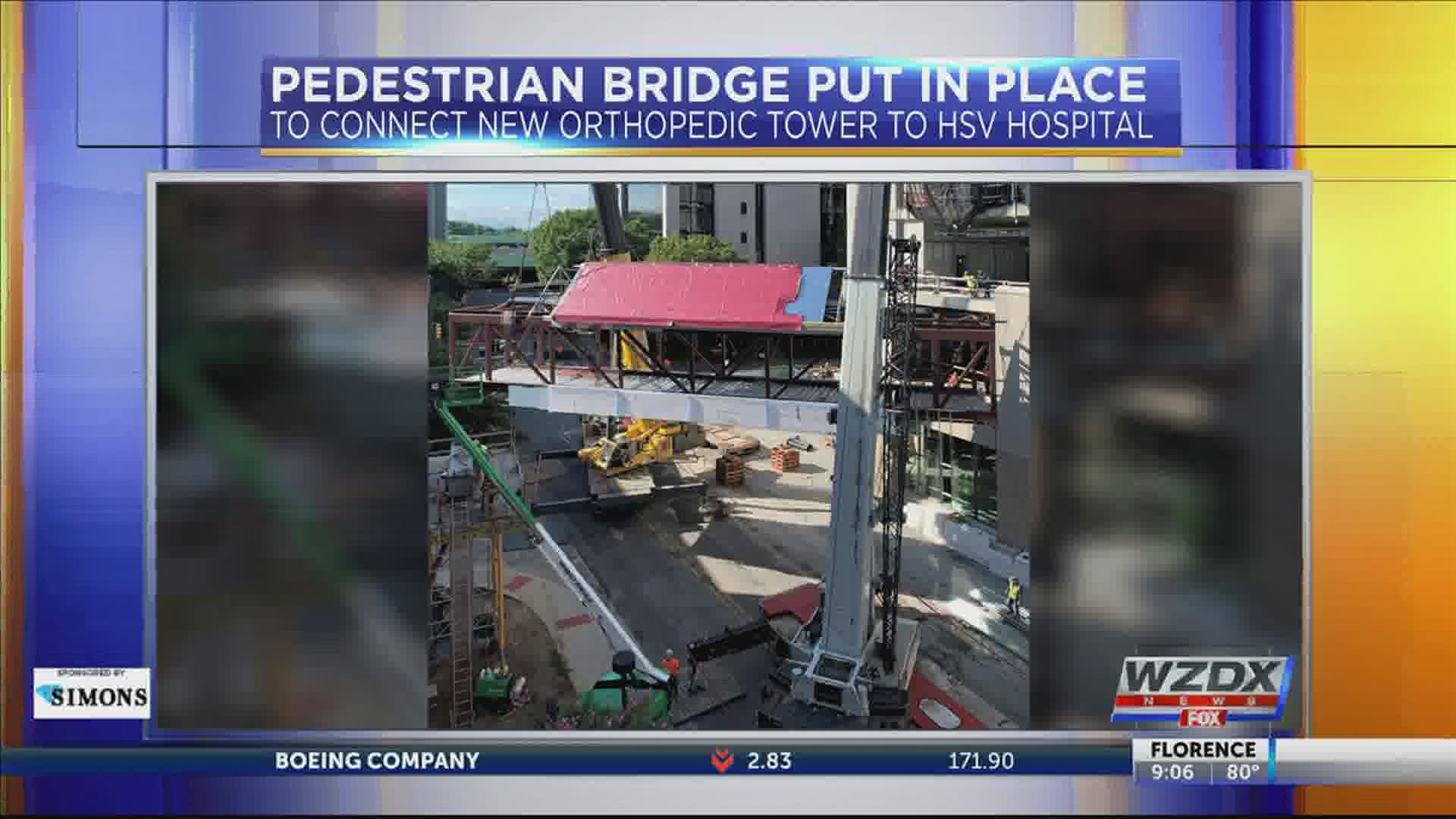 Pedestrian bridge installed connecting hospital, new tower ...