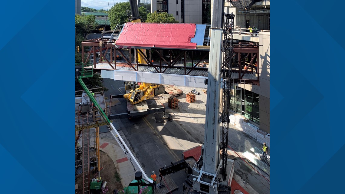 Pedestrian bridge installed connecting hospital, new tower ...