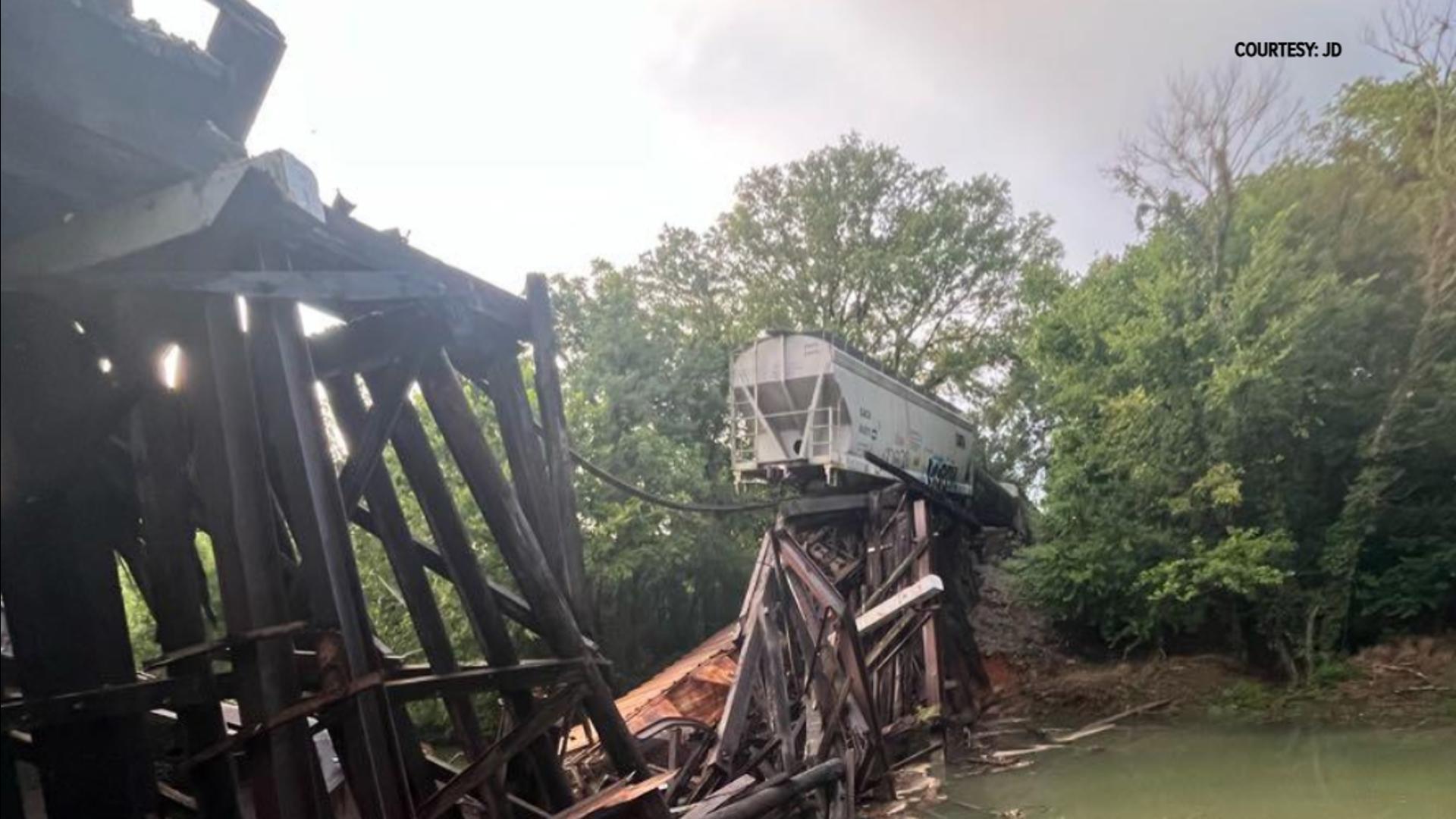 Fallen rail cars cleared from creek; work to begin on new bridge later ...